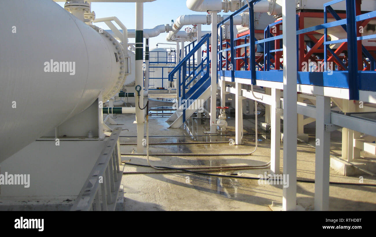 Steel service platform and stairs. Equipment refinery Stock Photo - Alamy