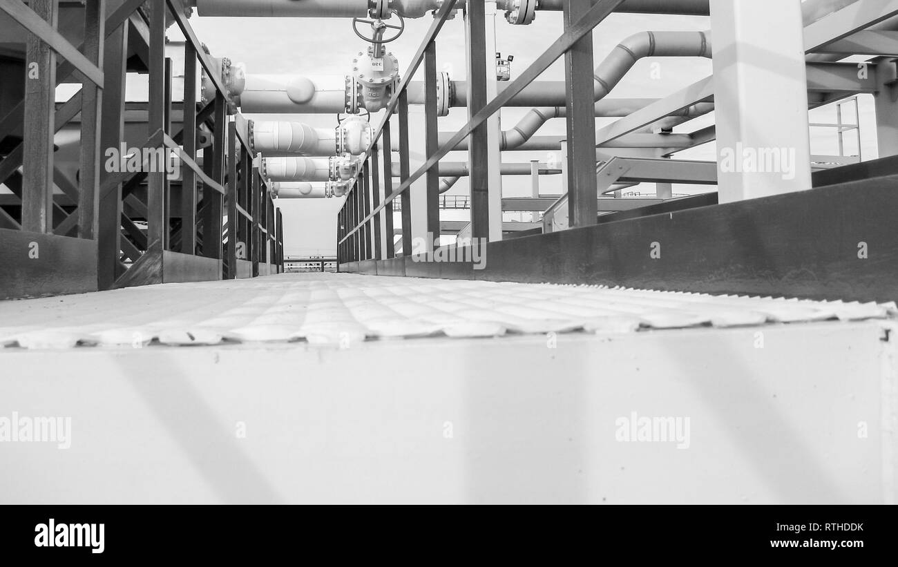 Steel service platform and stairs. Equipment refinery Stock Photo - Alamy