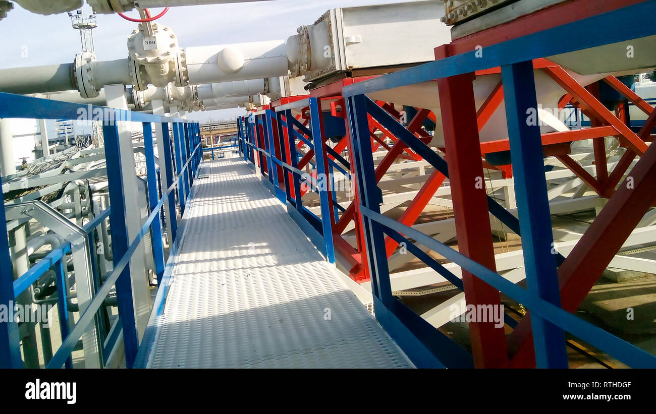 Steel service platform and stairs. Equipment refinery Stock Photo - Alamy