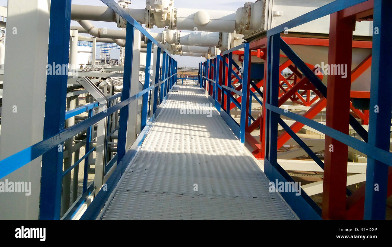 Steel service platform and stairs. Equipment refinery Stock Photo - Alamy