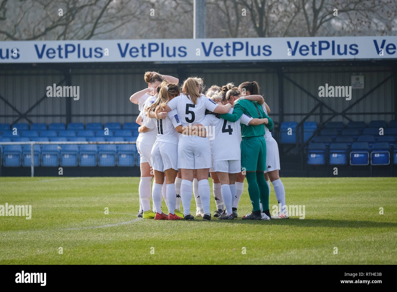 Women's Football Team in a group huddle prior to kick-off Stock Photo ...