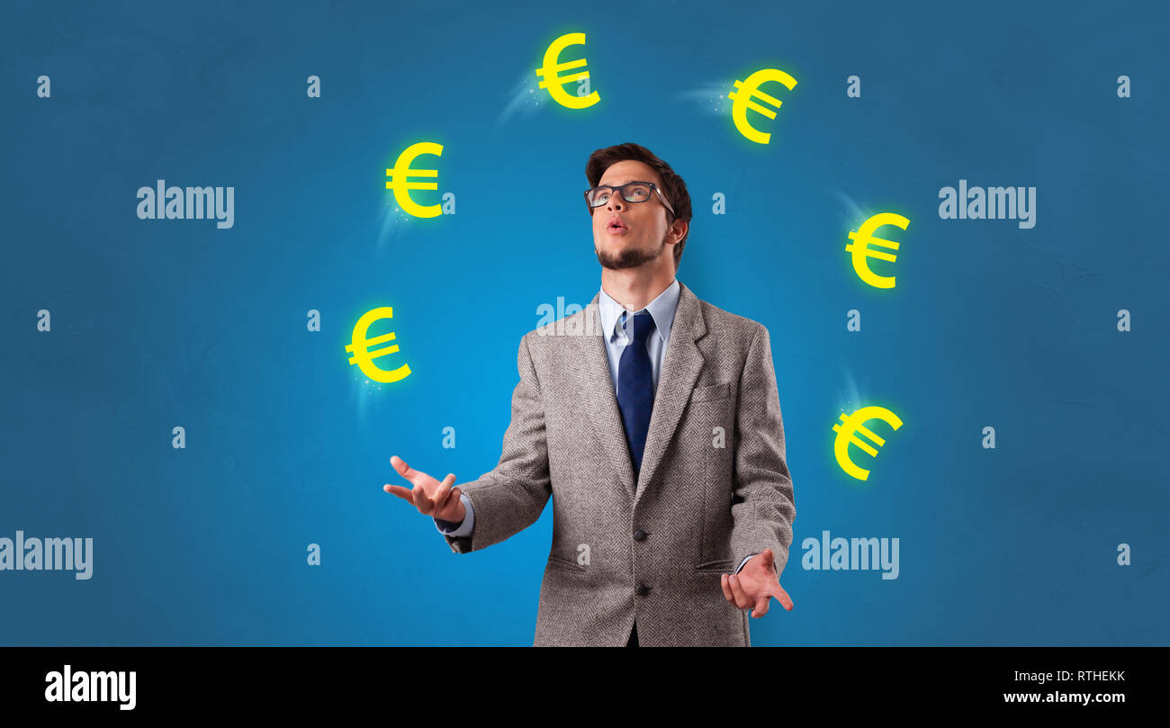 Young happy person juggle with euro symbol Stock Photo - Alamy
