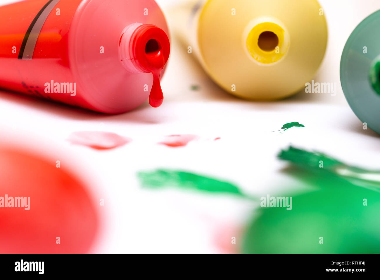 Paint drops out of acrylic tube. Paint squeezed out of the tube Stock ...