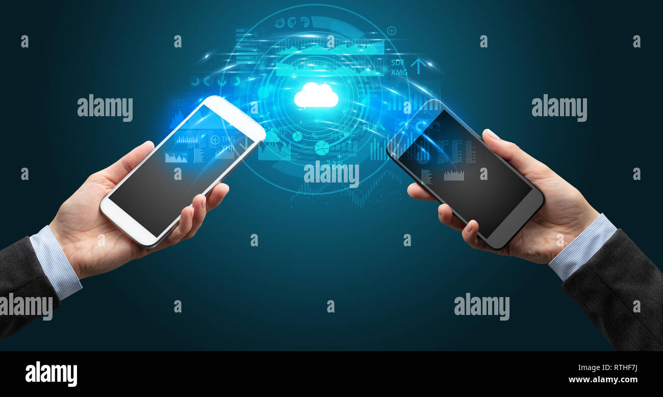Two mobile phones syncing through the cloud Stock Photo - Alamy