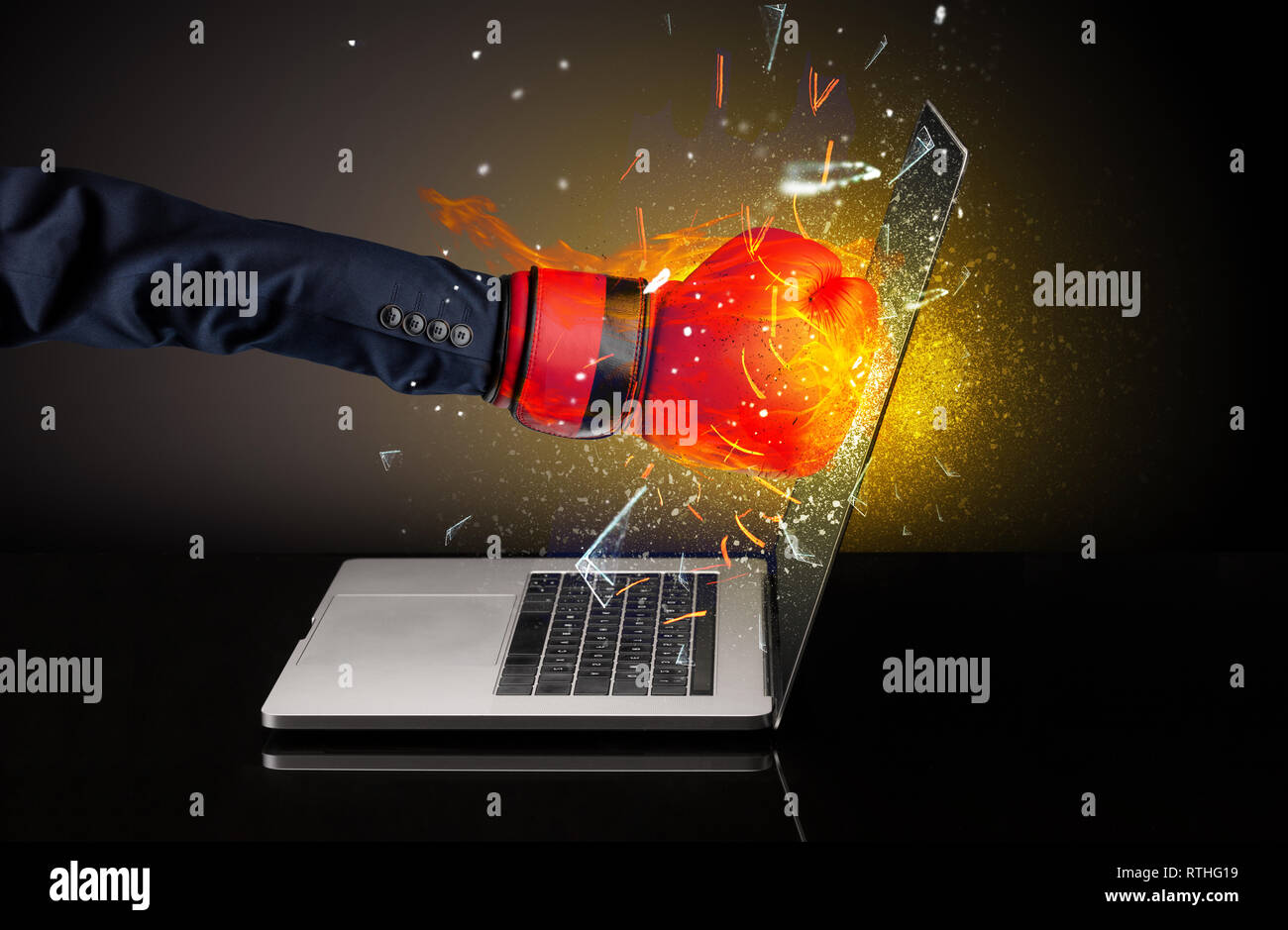 Firing hand hitting strongly laptop screen glass Stock Photo - Alamy