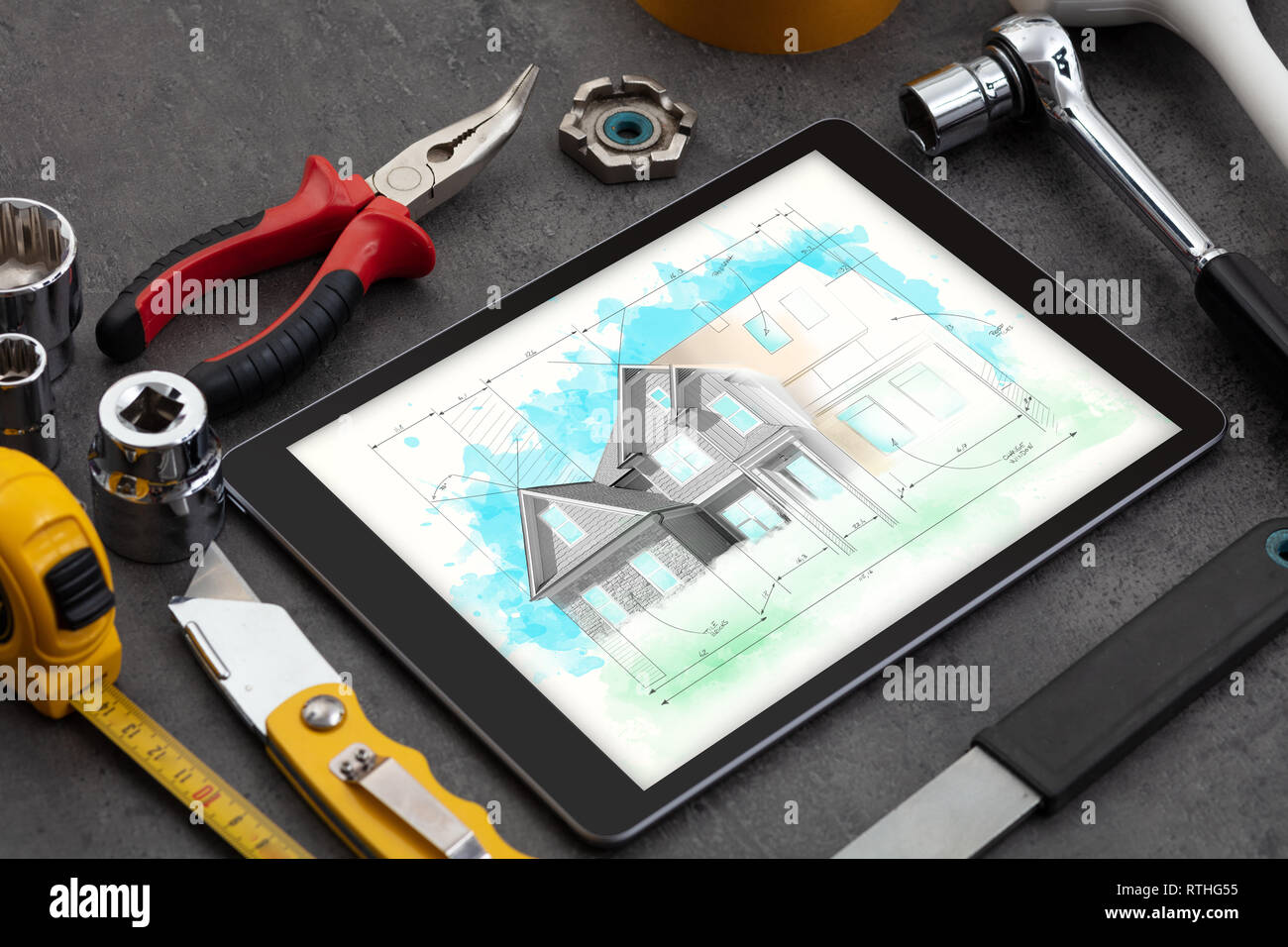 Tablet with construction tools and house plan concept Stock Photo - Alamy