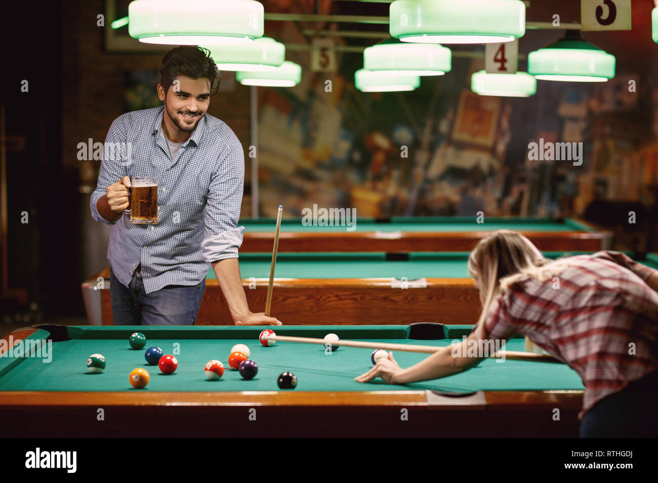billiard game- Couple enjoying playing billiard game Stock Photo - Alamy