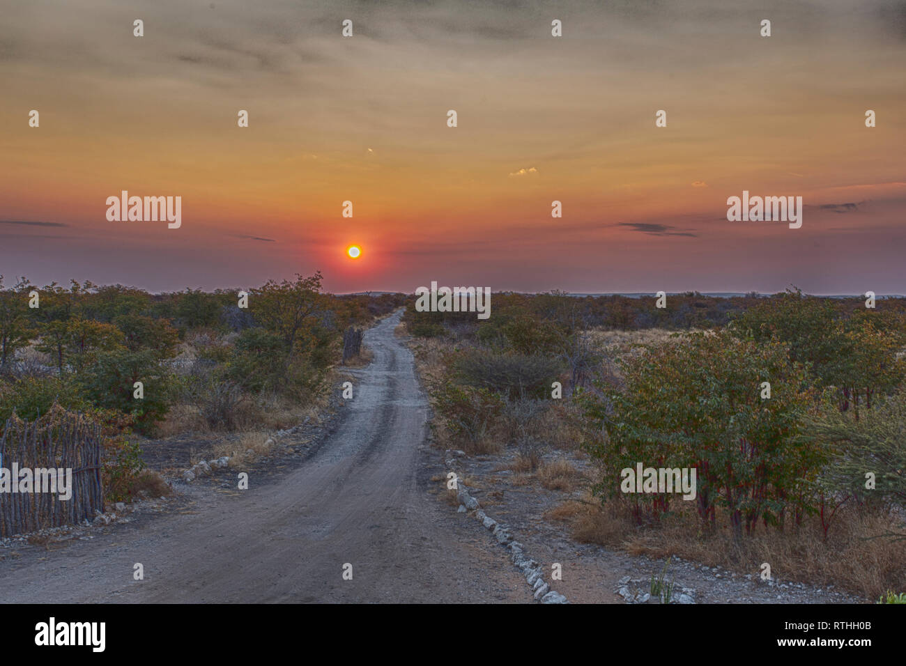 A beautiful sunset during August in Namibia Stock Photo - Alamy