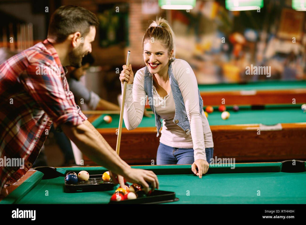 billiard - Couple enjoying while playing billiard in bar Stock Photo ...