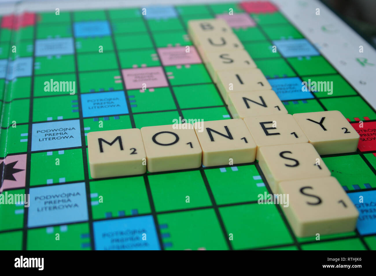 inscription business and money made of scrabble tiles Stock Photo - Alamy