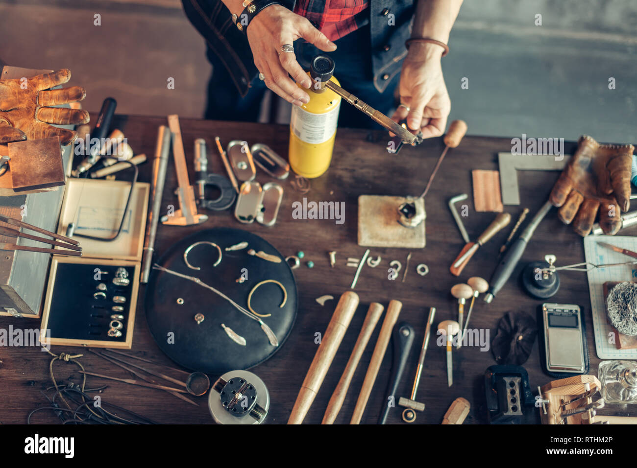 man preparing the tool for melting the metal, close up cropped photo ...