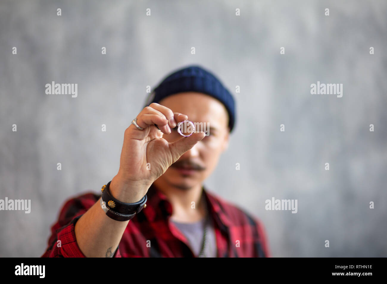 young man evaluating the ring. close up photo.focus on the luxury ...