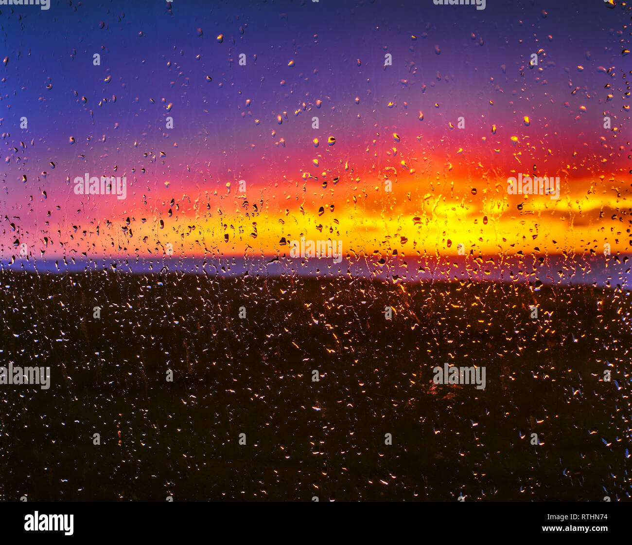 rainy sunset in the window Stock Photo - Alamy