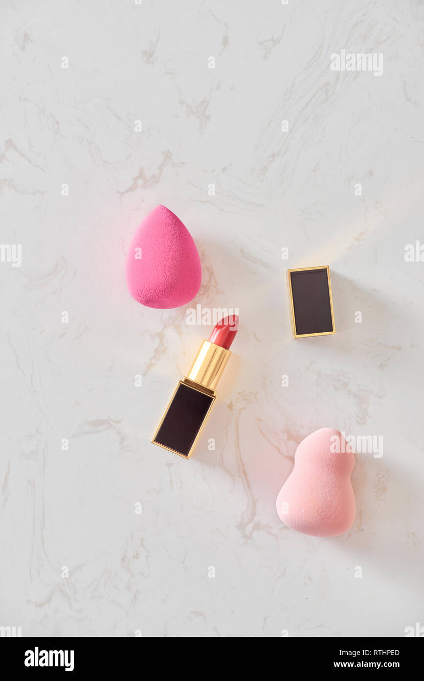 Feminine cosmetic background. Overhead of essentials of a modern woman ...