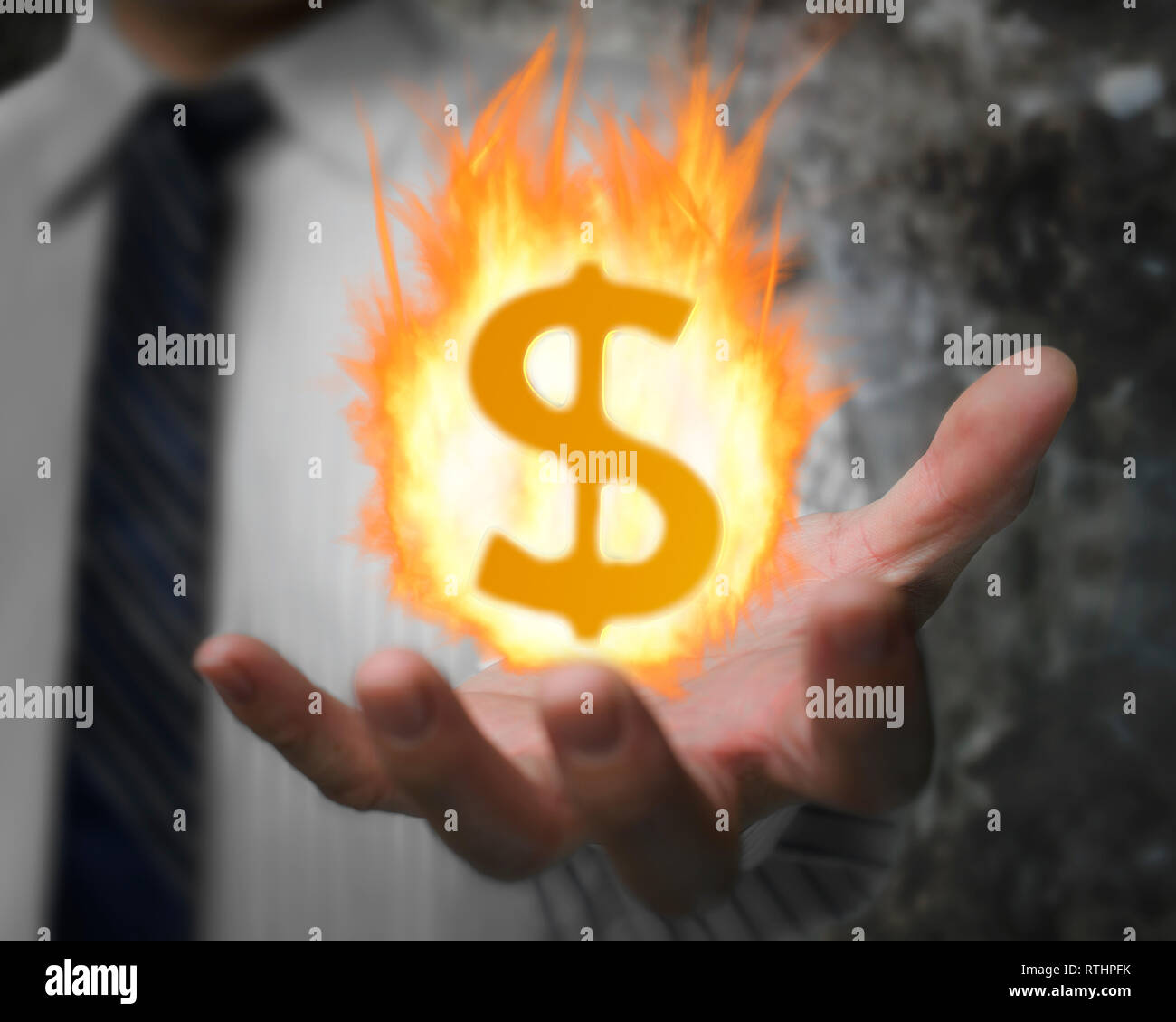 Burning fire ball of dollar sign in the businessman's hand Stock Photo ...