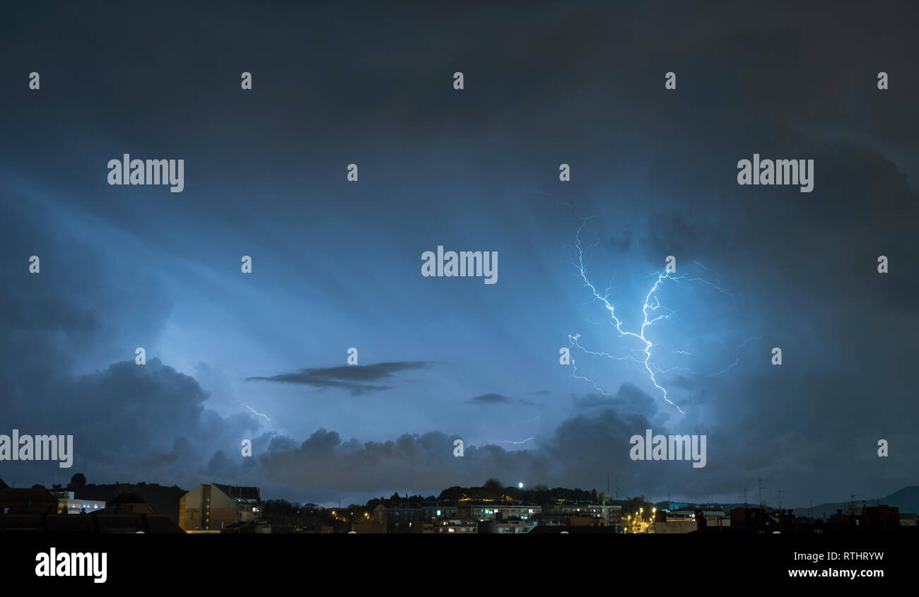 Thunderstorm scene with lightning. Dramatic clouds of the cityscape of ...