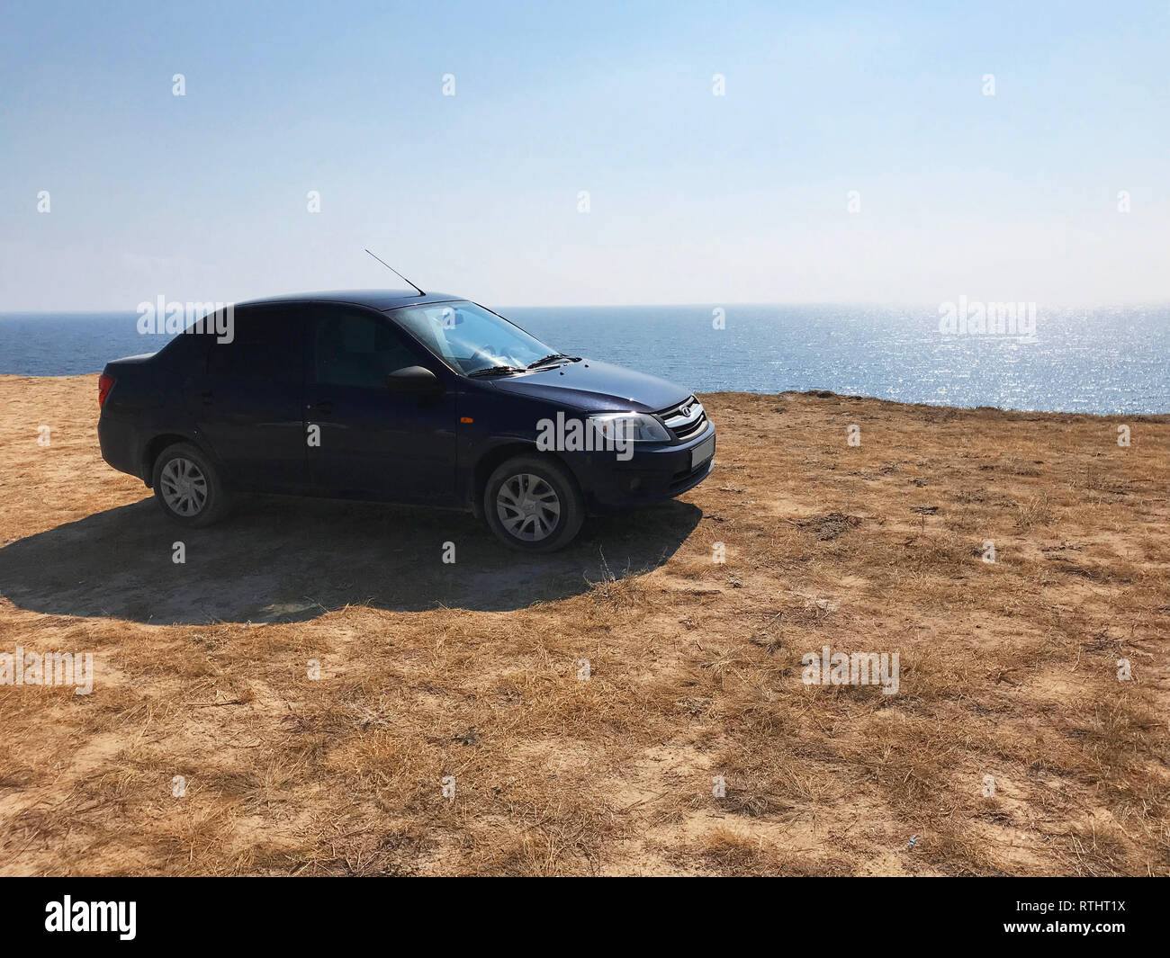 The image in front of the sports car scene behind as the sun going down ...