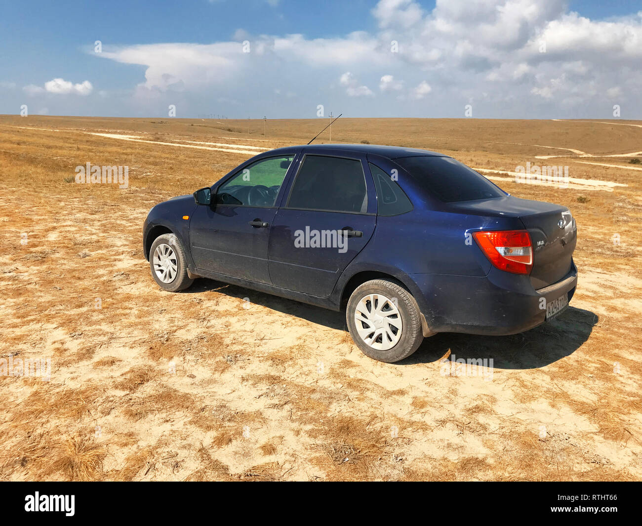 The image in front of the sports car scene behind as the sun going down ...