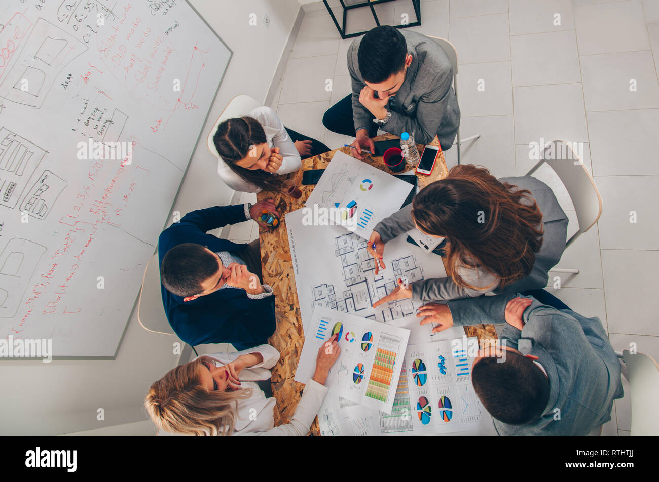 Group of people are having a collaboration about the diagrams in the ...