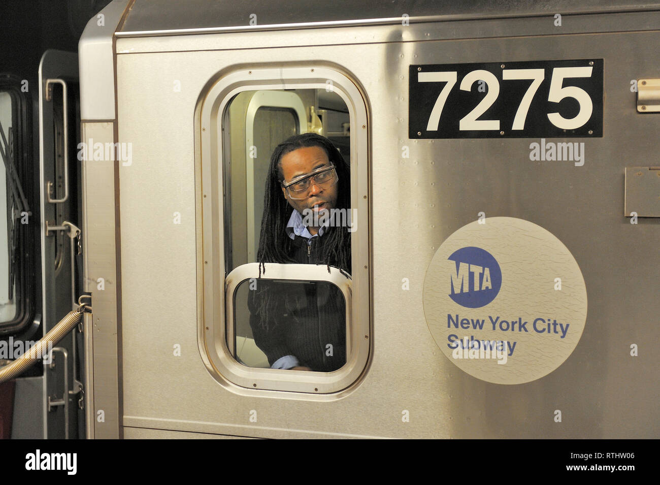 New York, USA-November 11, 2012: A subway driver in New York City looks ...