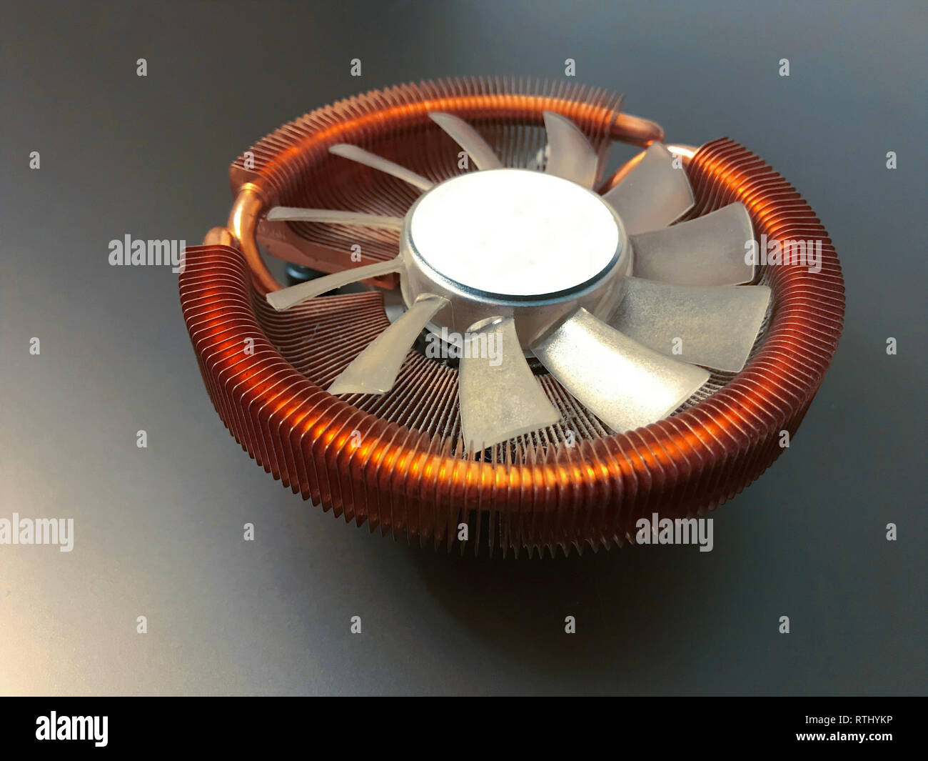 CPU cooler with copper plates on a gray background Stock Photo - Alamy