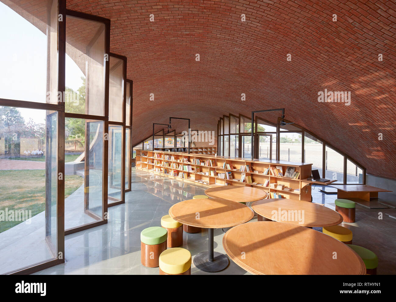 Interior view with late afternoon sun. Maya Somaiya Library, Kopargaon ...