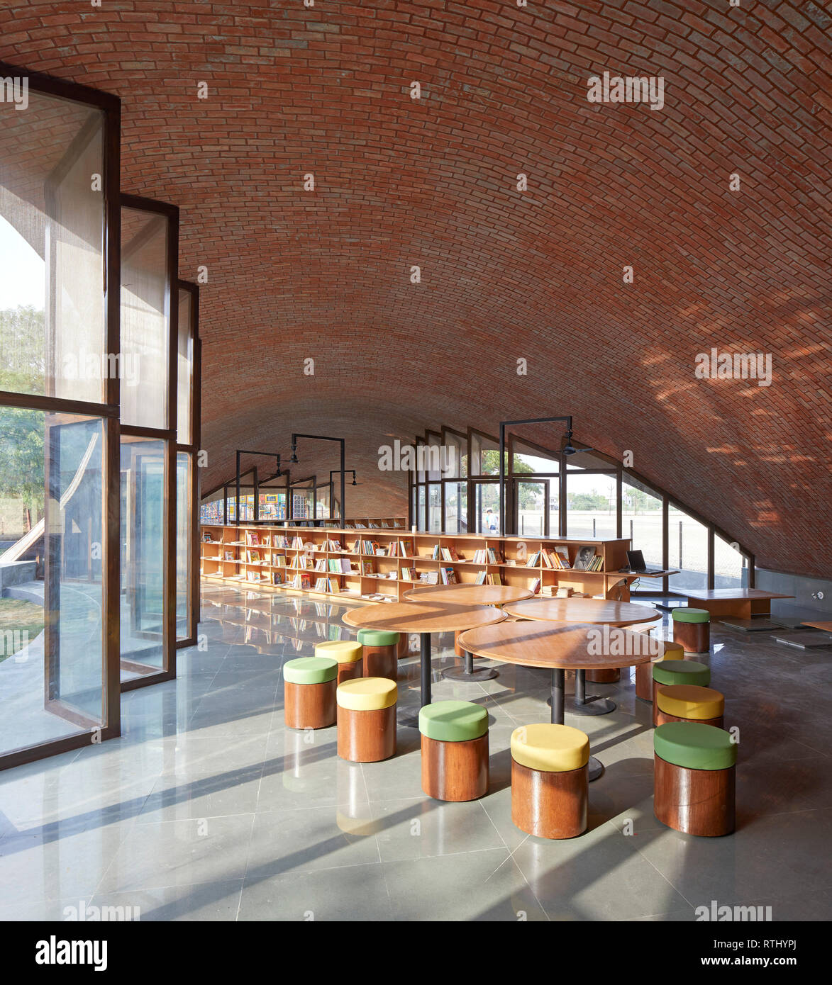Interior view with late afternoon sun. Maya Somaiya Library, Kopargaon ...