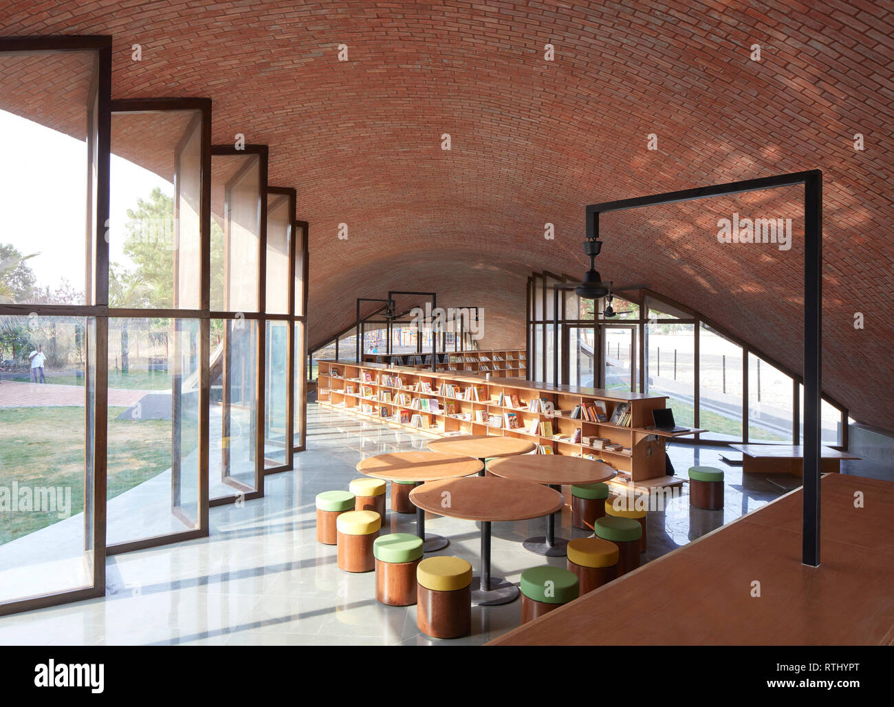 Interior view with late afternoon sun. Maya Somaiya Library, Kopargaon ...