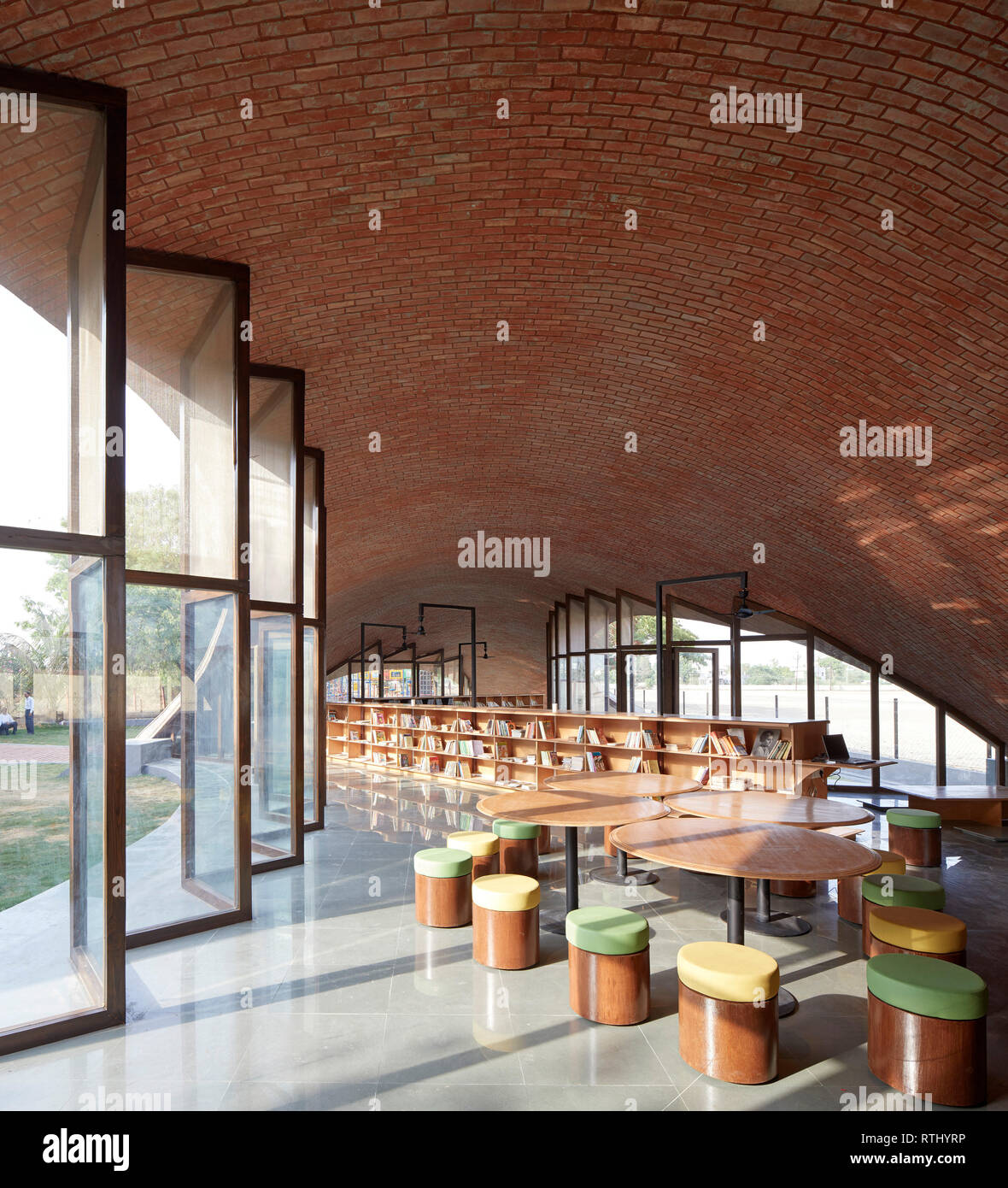 Interior view with late afternoon sun. Maya Somaiya Library, Kopargaon ...