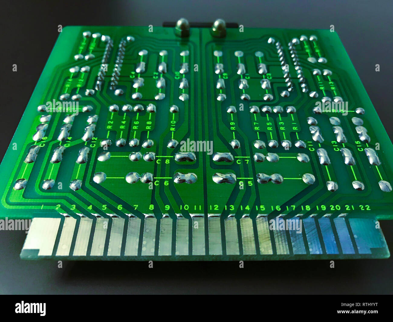 Shot of the back side of a green computer circuit board on black ...