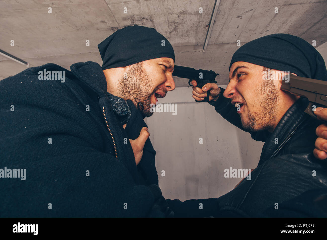 Two People Gun Head High Resolution Stock Photography and Images - Alamy