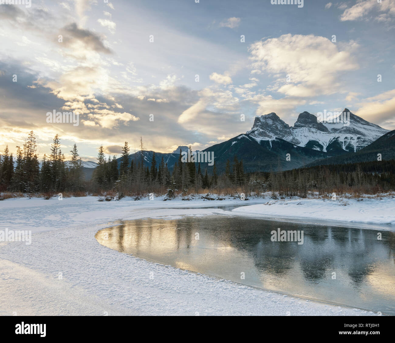 Snow covered Three Sisters peaks from Policeman Creek after sunrise ...