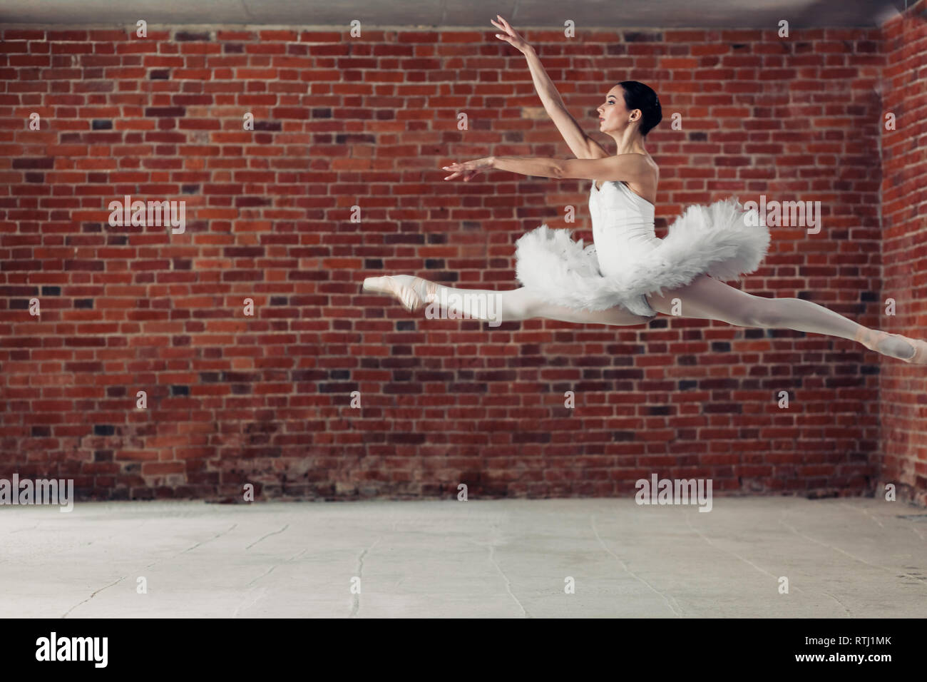 powerful jump in the ballet. full length side view photo. amazing art ...