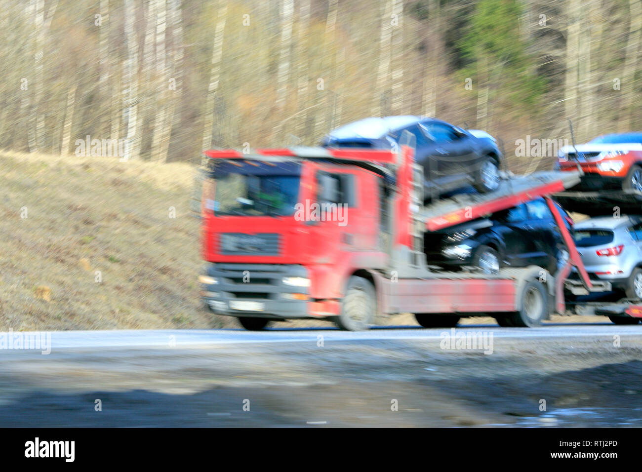 Delivery track car transporter speeding on a highway Stock Photo - Alamy