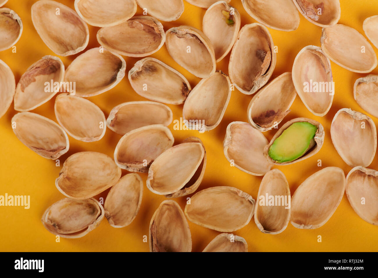 Eating healthy food theme. Empty pistachio shell above top view Stock ...