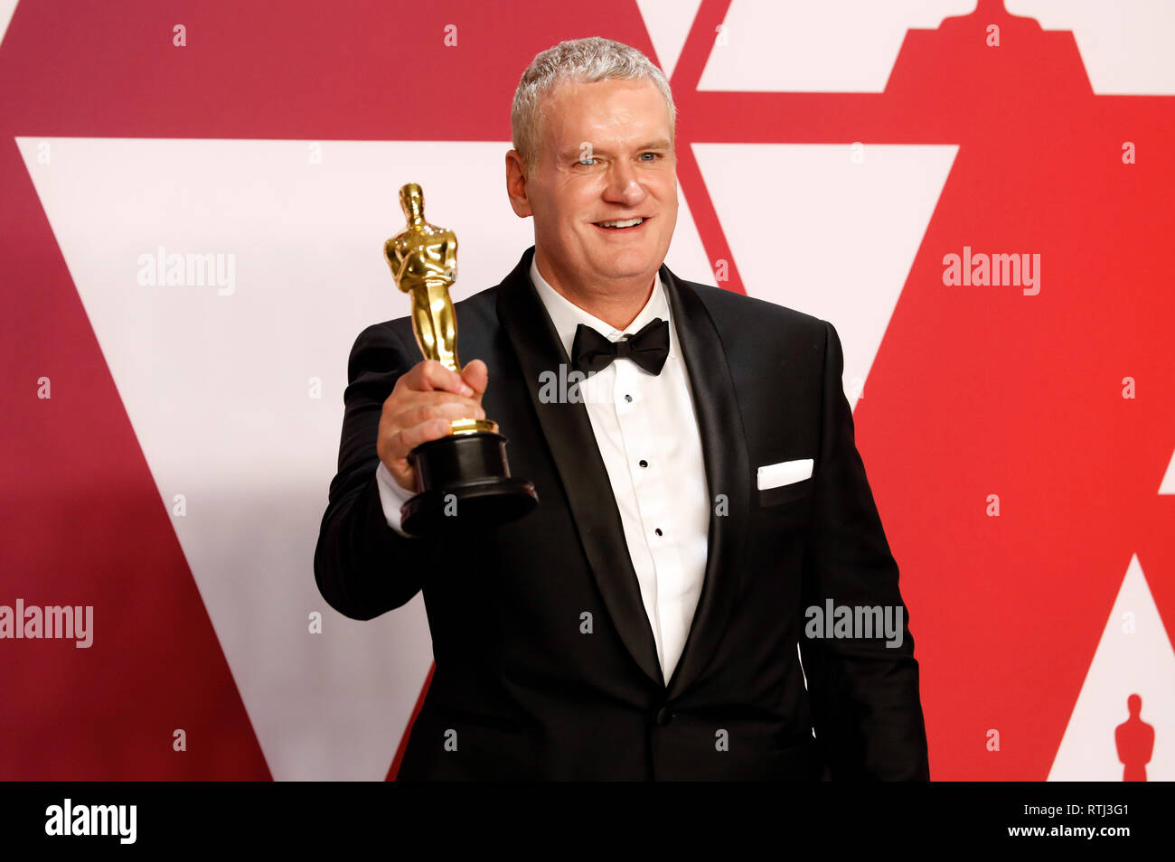 John Ottman, winner of Best Film Editing for 'Bohemian Rhapsody', poses ...
