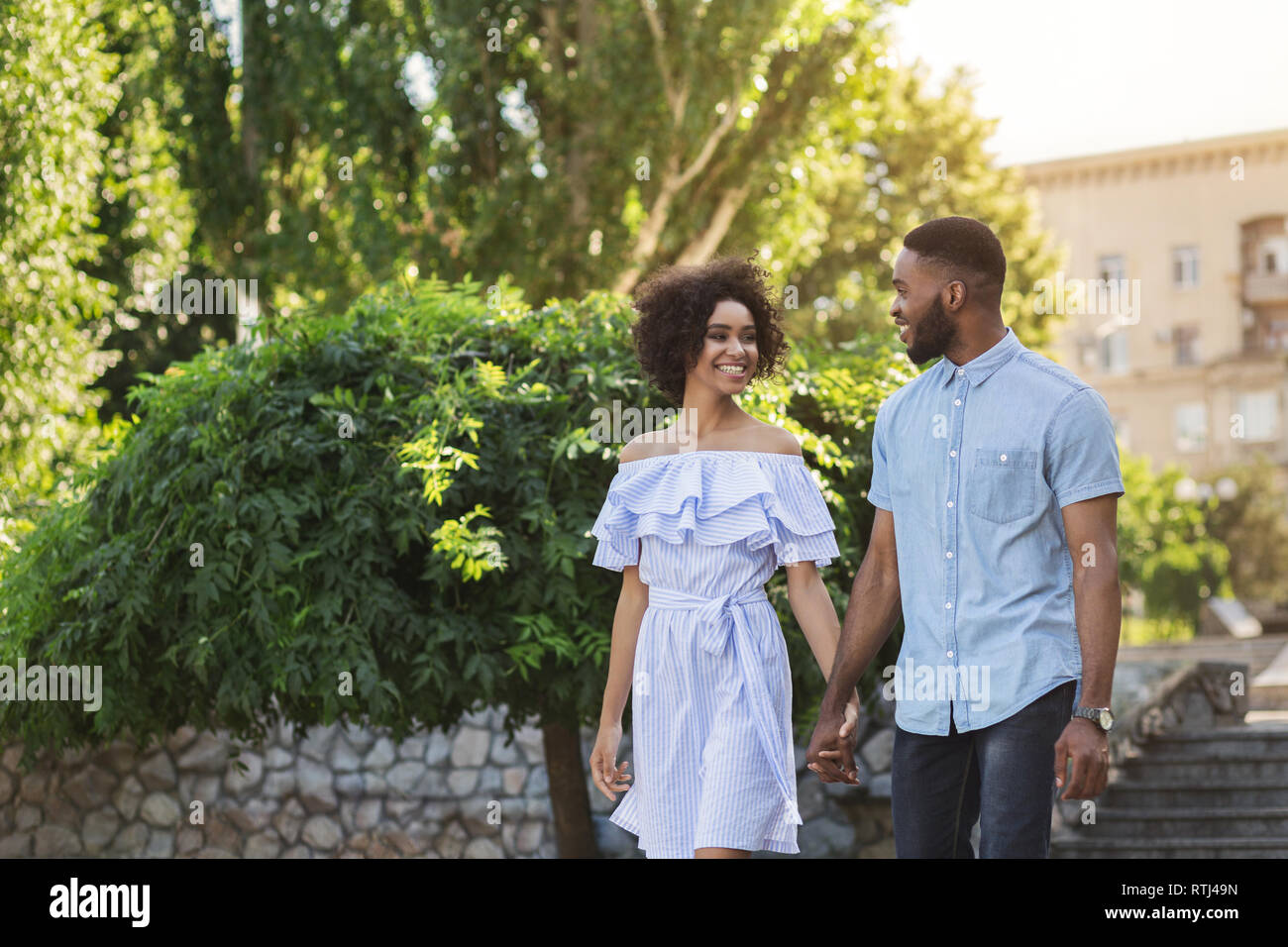Black couple walking in park hi-res stock photography and images - Alamy