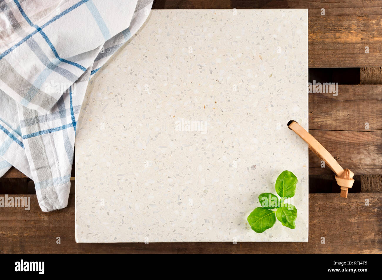 Concrete stone server with space for text on rustic wood plank surface ...