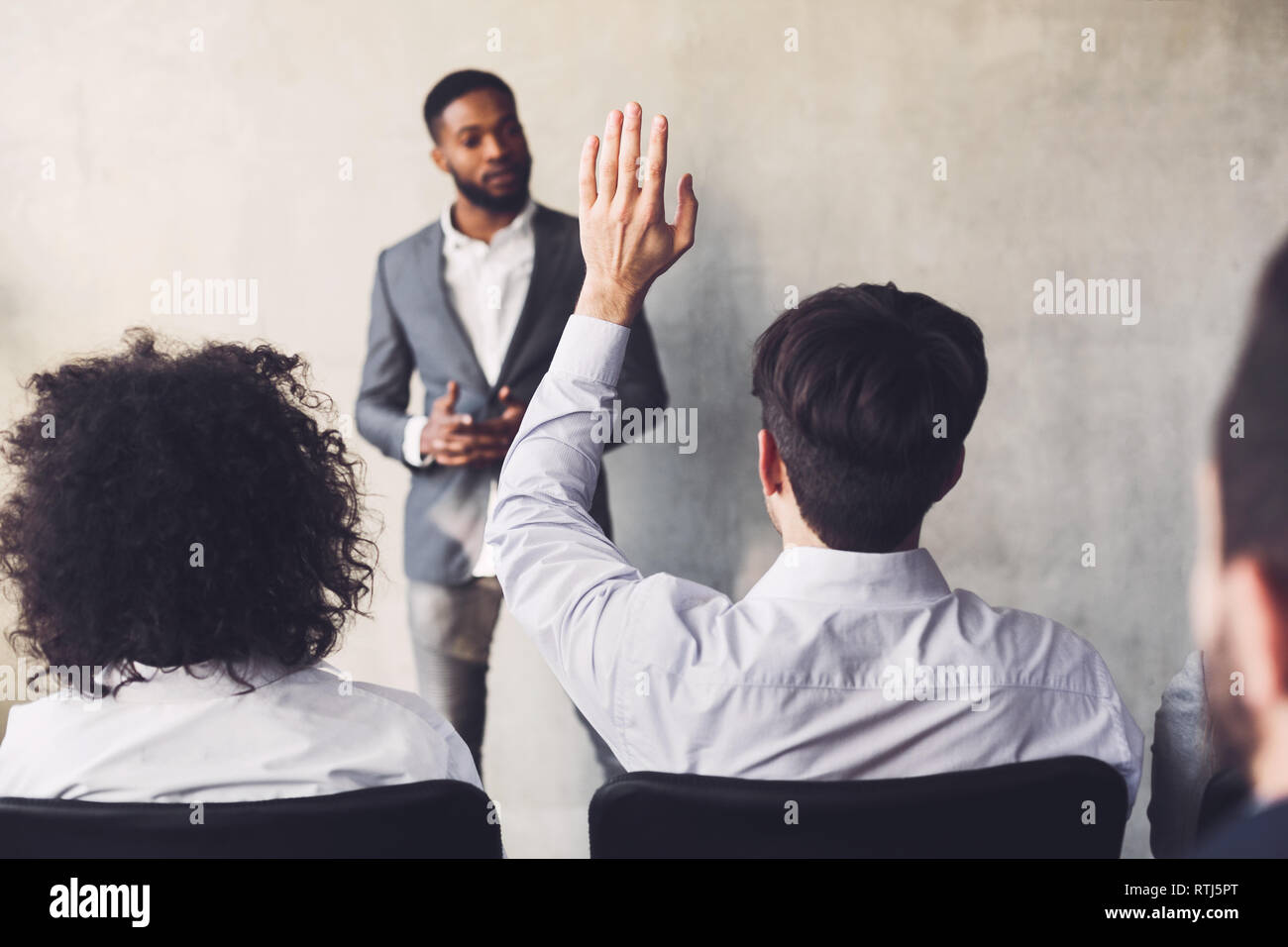 I have question. Businessman raising his hand Stock Photo - Alamy