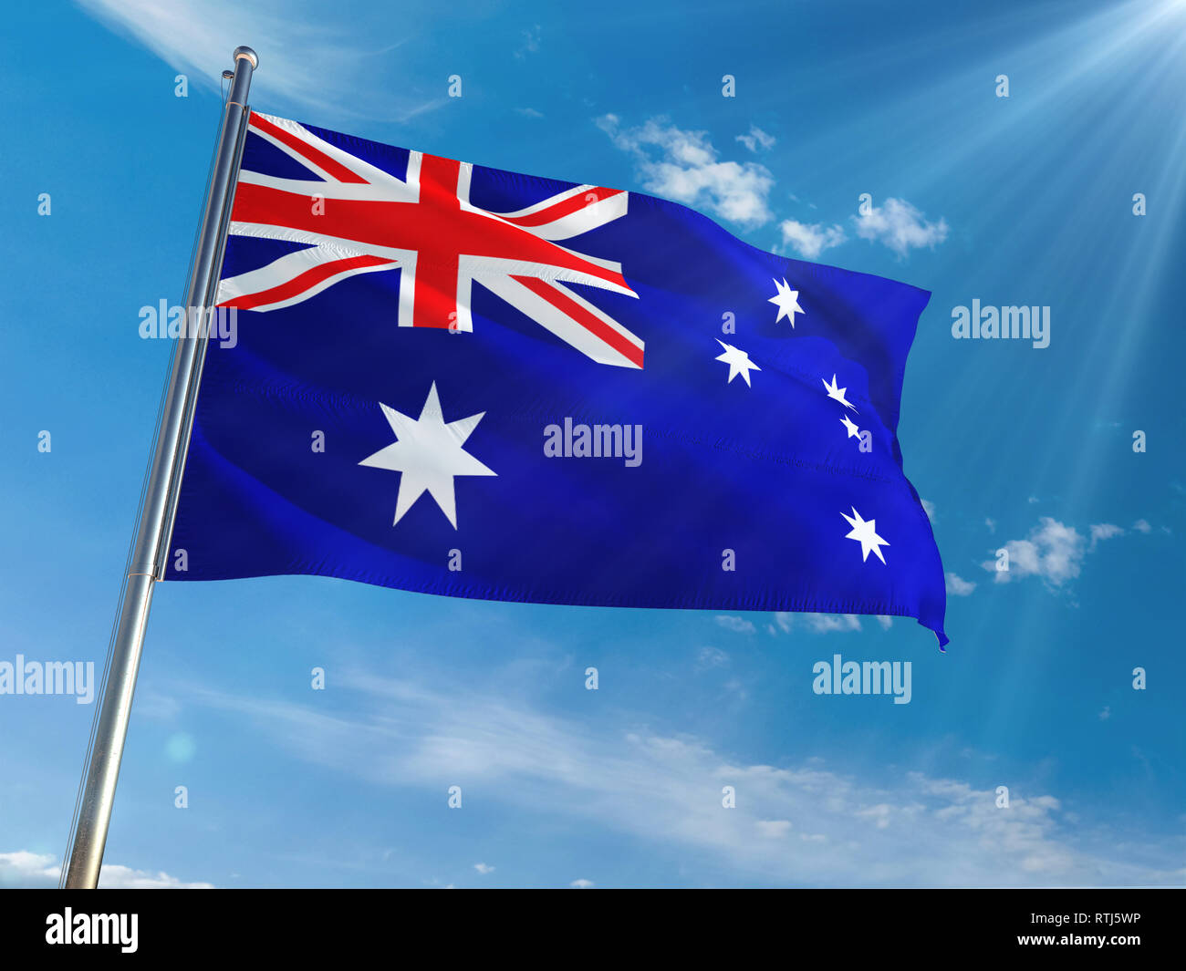 Australia National Flag Waving on pole against sunny blue sky ...