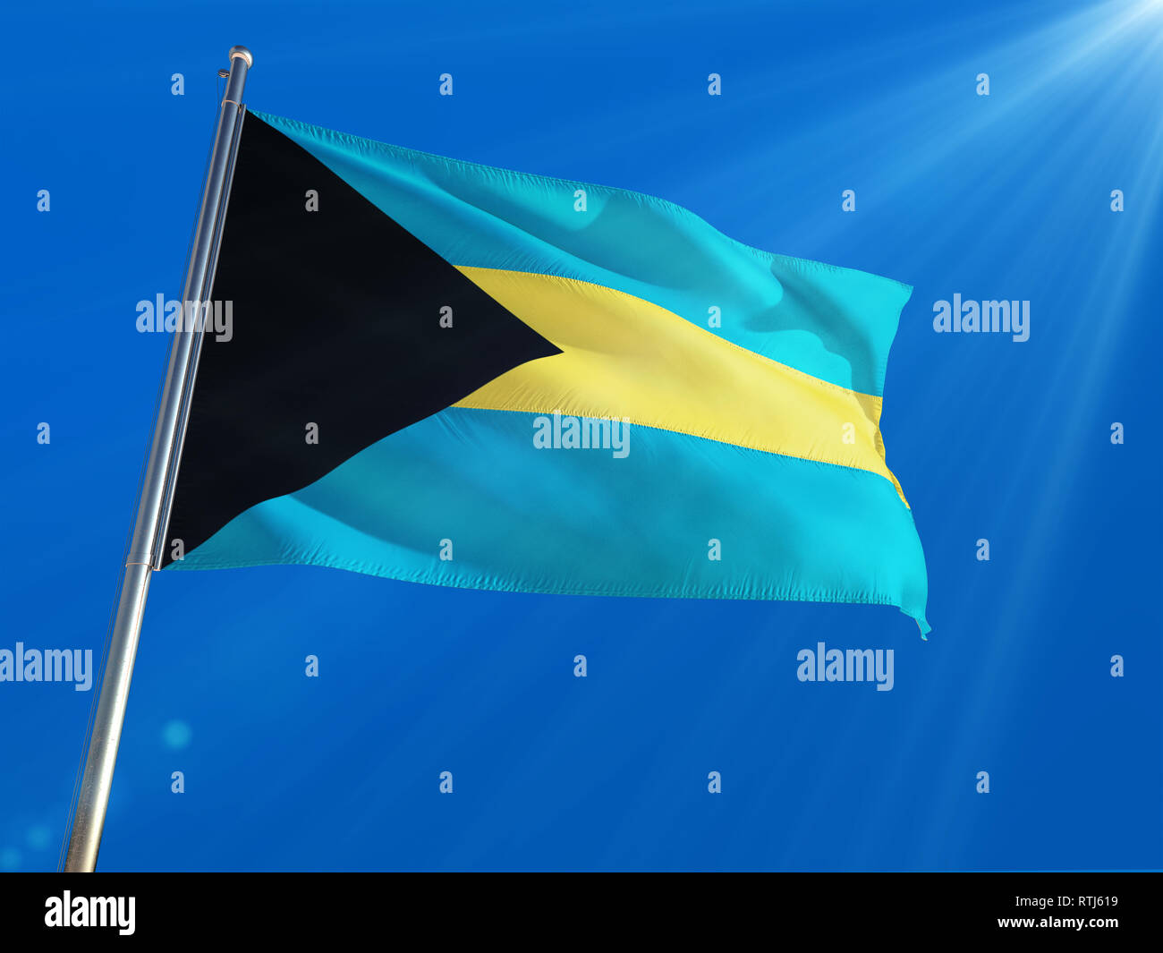 Bahamas National Flag Waving on pole against deep blue sky background ...