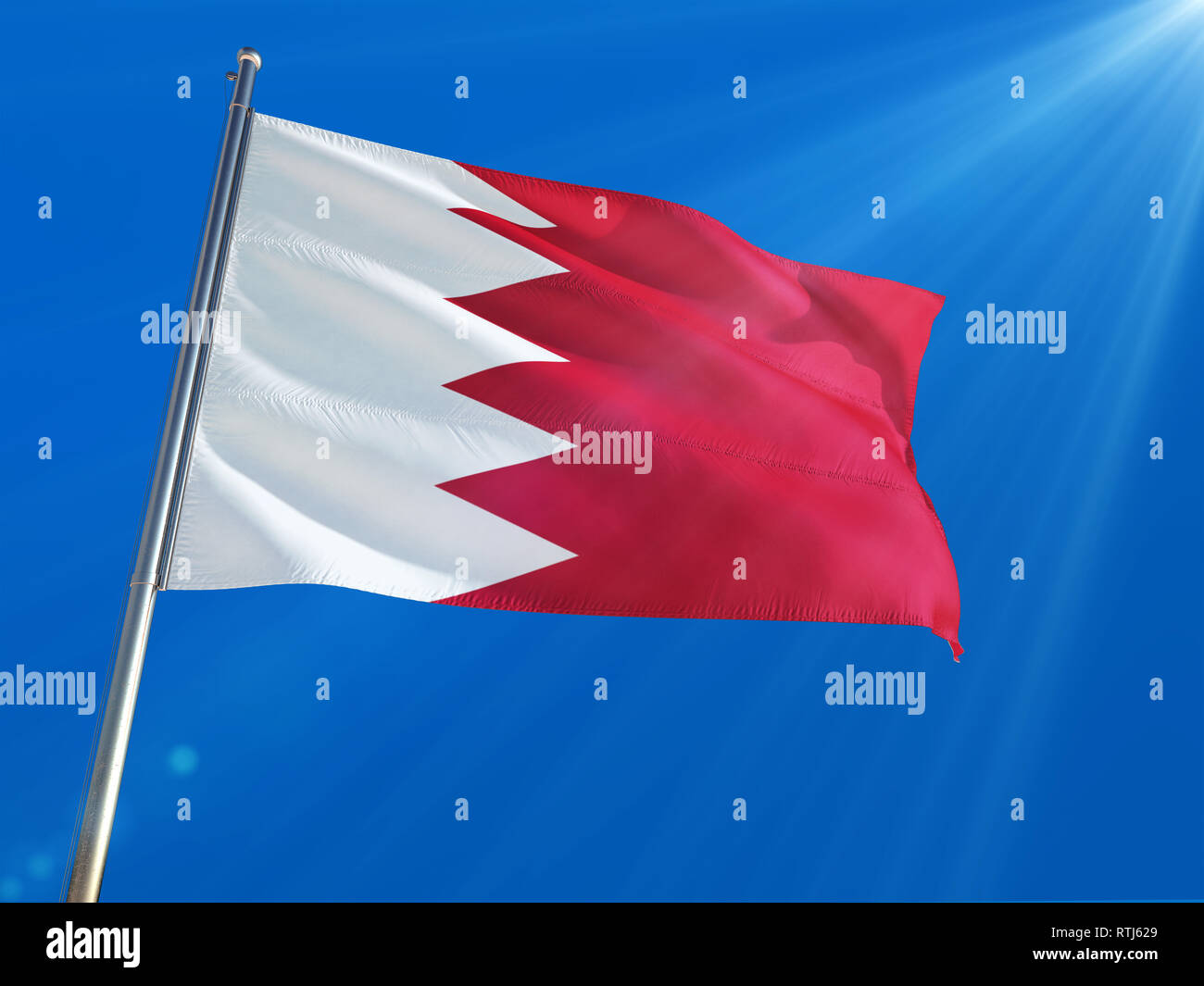 Bahrain National Flag Waving on pole against deep blue sky background ...