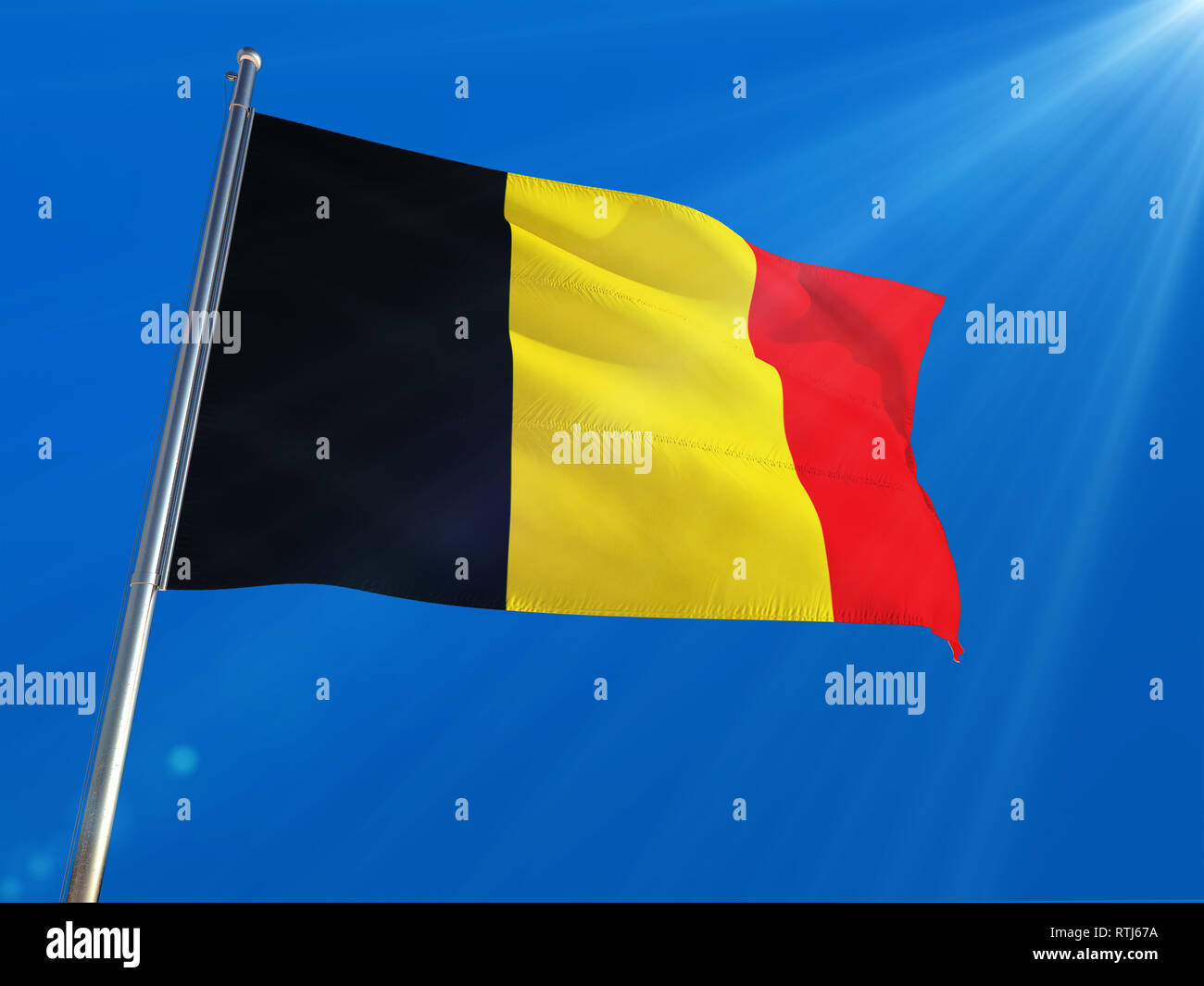 Belgium National Flag Waving on pole against deep blue sky background ...