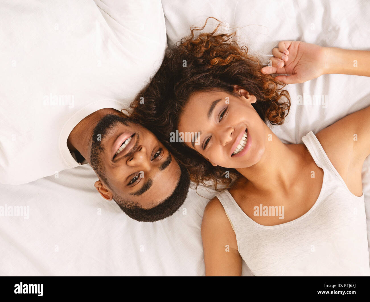 Couple lying in bed together hi-res stock photography and images - Alamy