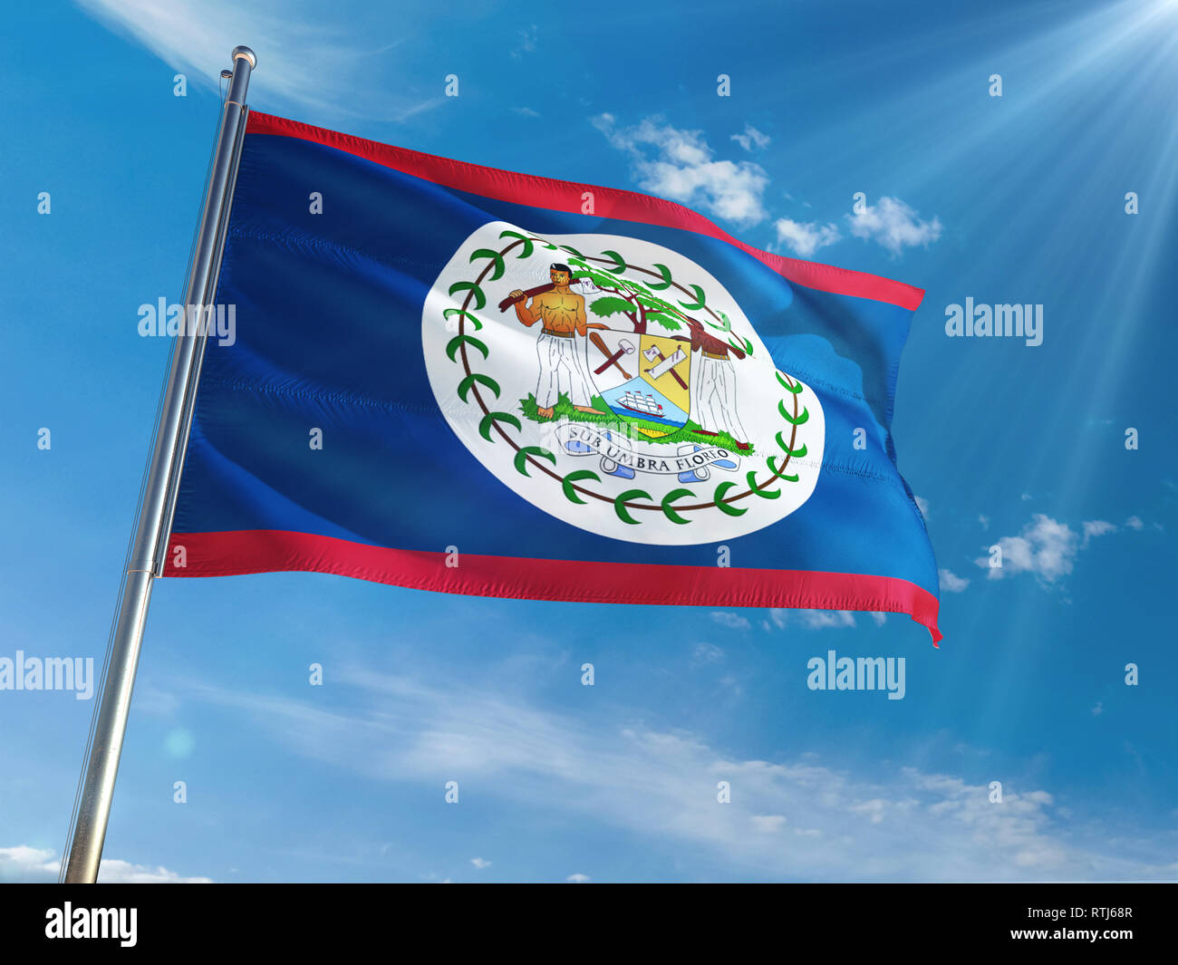 Belize National Flag Waving on pole against sunny blue sky background ...