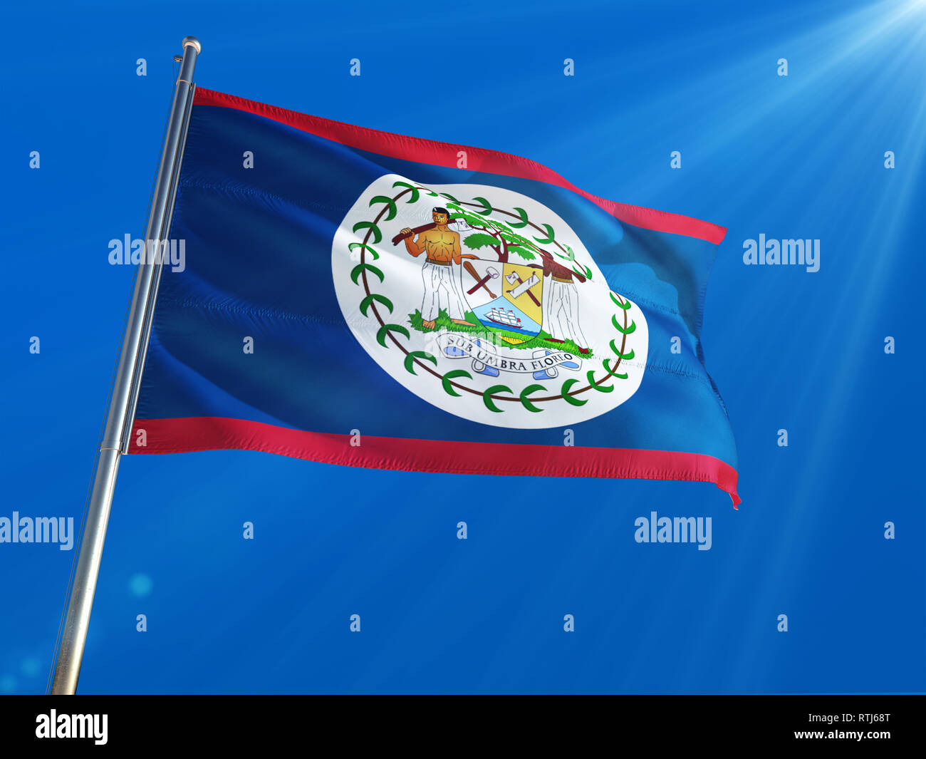 Belize National Flag Waving on pole against deep blue sky background ...