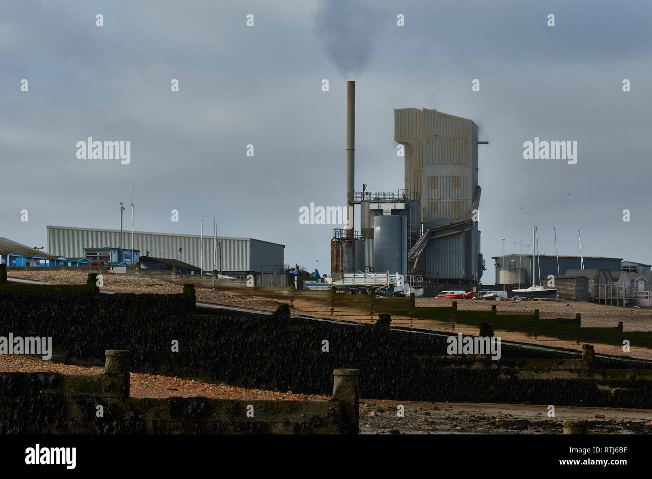 Whitstable landscape with Brett aggregates factory, Kent, England ...