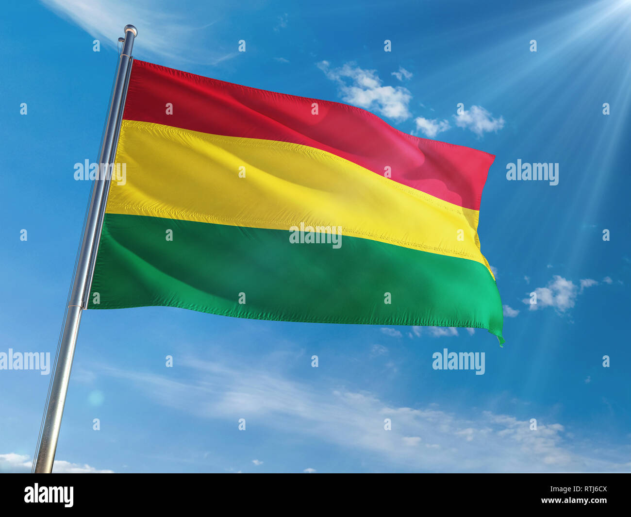 Bolivia National Flag Waving on pole against sunny blue sky background ...