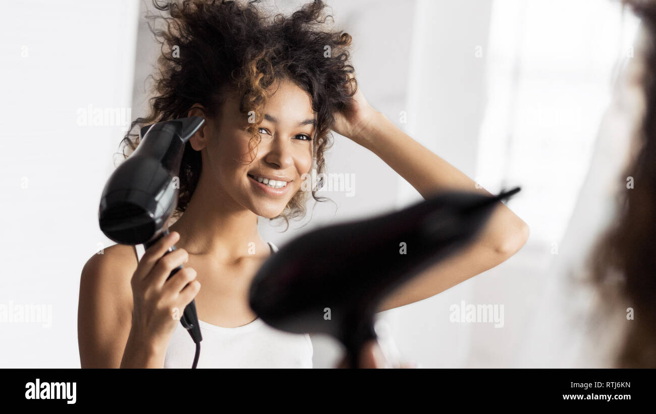 Drying wild curly hair concept Stock Photo - Alamy
