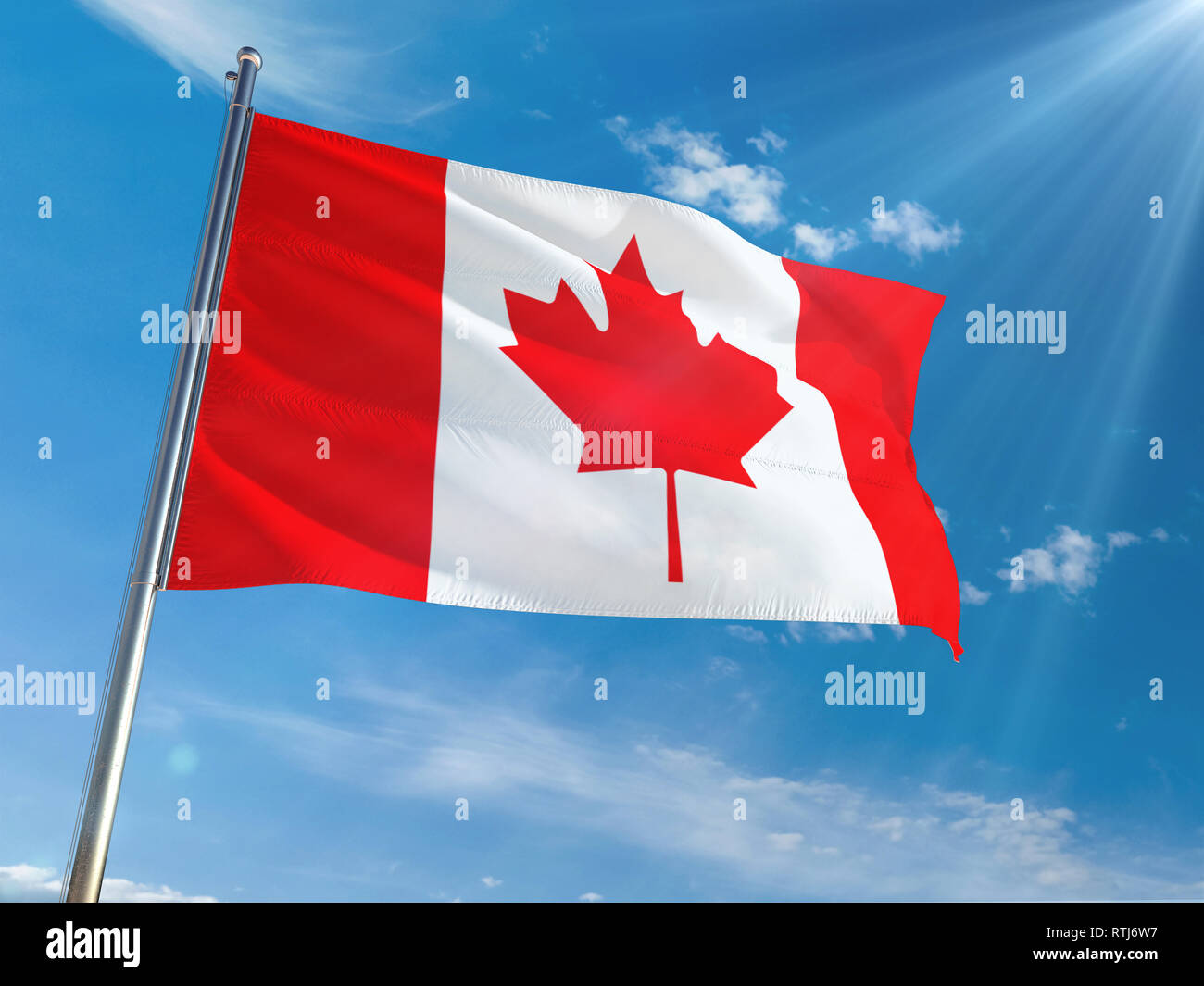Canada National Flag Waving on pole against sunny blue sky background ...